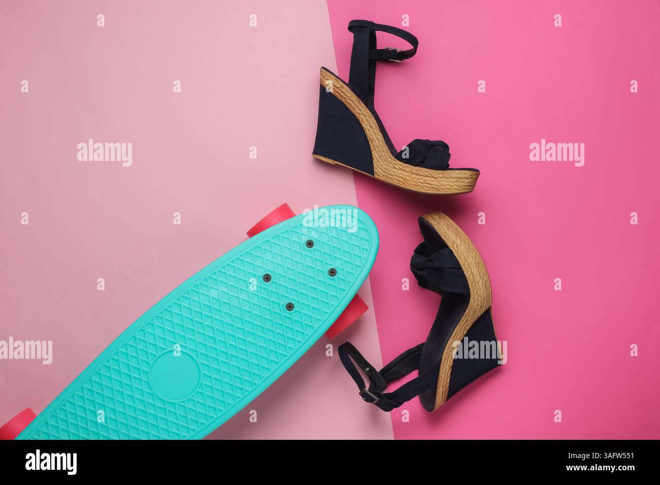 Summer fun. Women's sandals on platform with cruiser board on pink ...