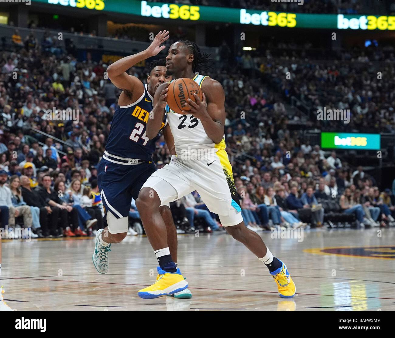 Indiana Pacers forward Aaron Nesmith (23) drives past Denver Nuggets ...