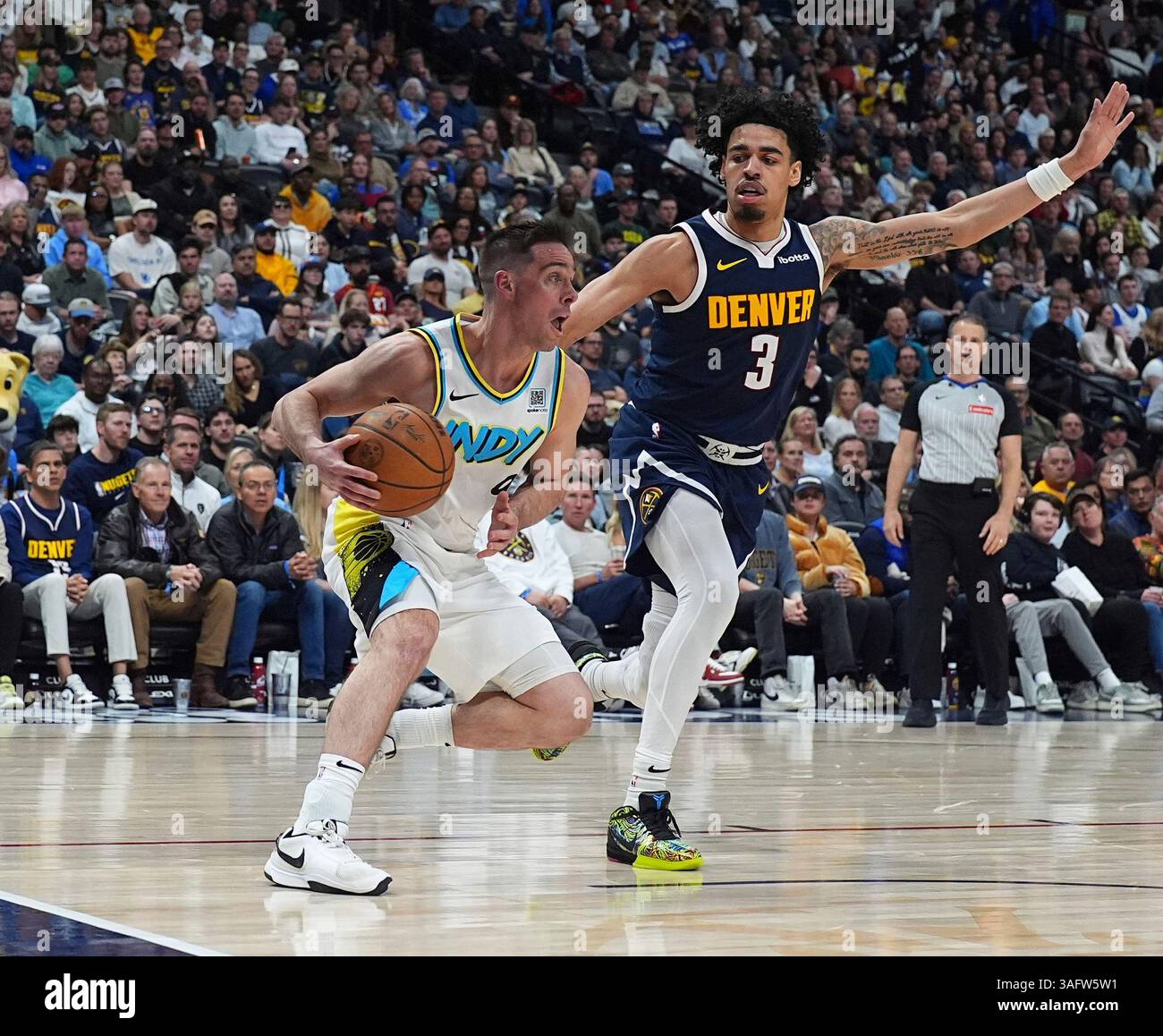 Indiana Pacers guard T.J. McConnell (9) and Denver Nuggets guard Julian ...