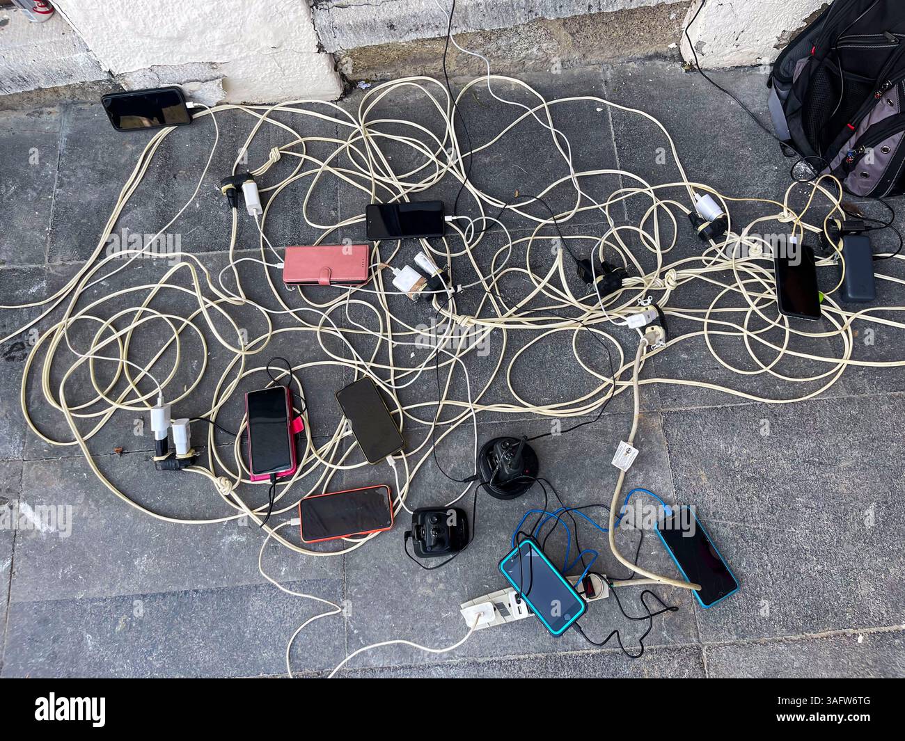 smartphones , Charging cell phones with a power strip at a hotel gas ...