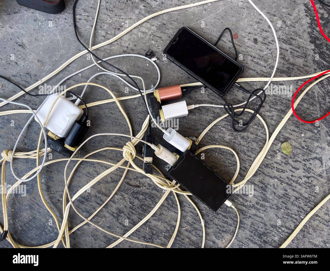 smartphones , Charging cell phones with a power strip at a hotel gas ...