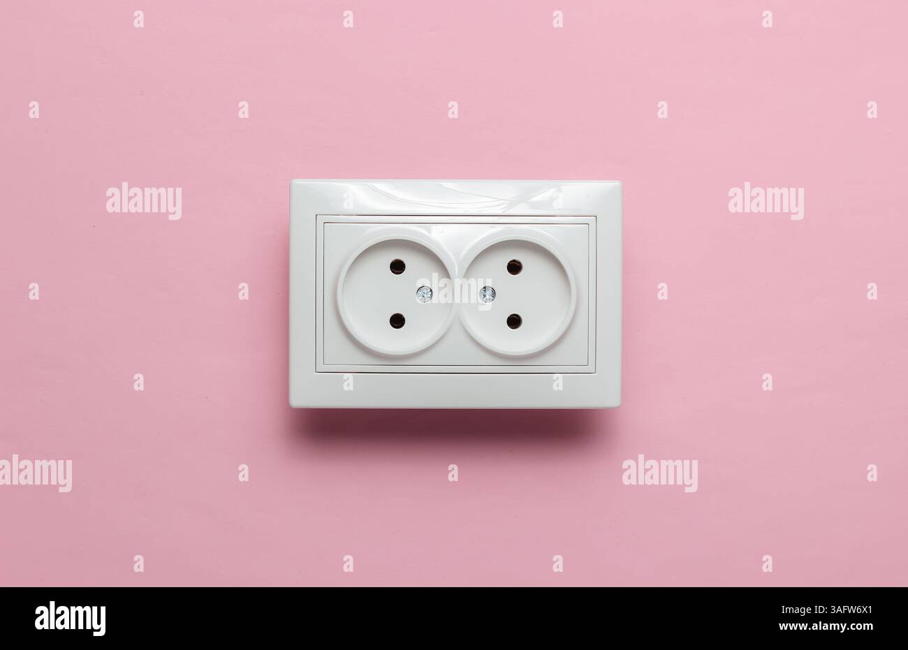 Double power socket on pink wall. Studio shot. Minimalism Stock Photo ...