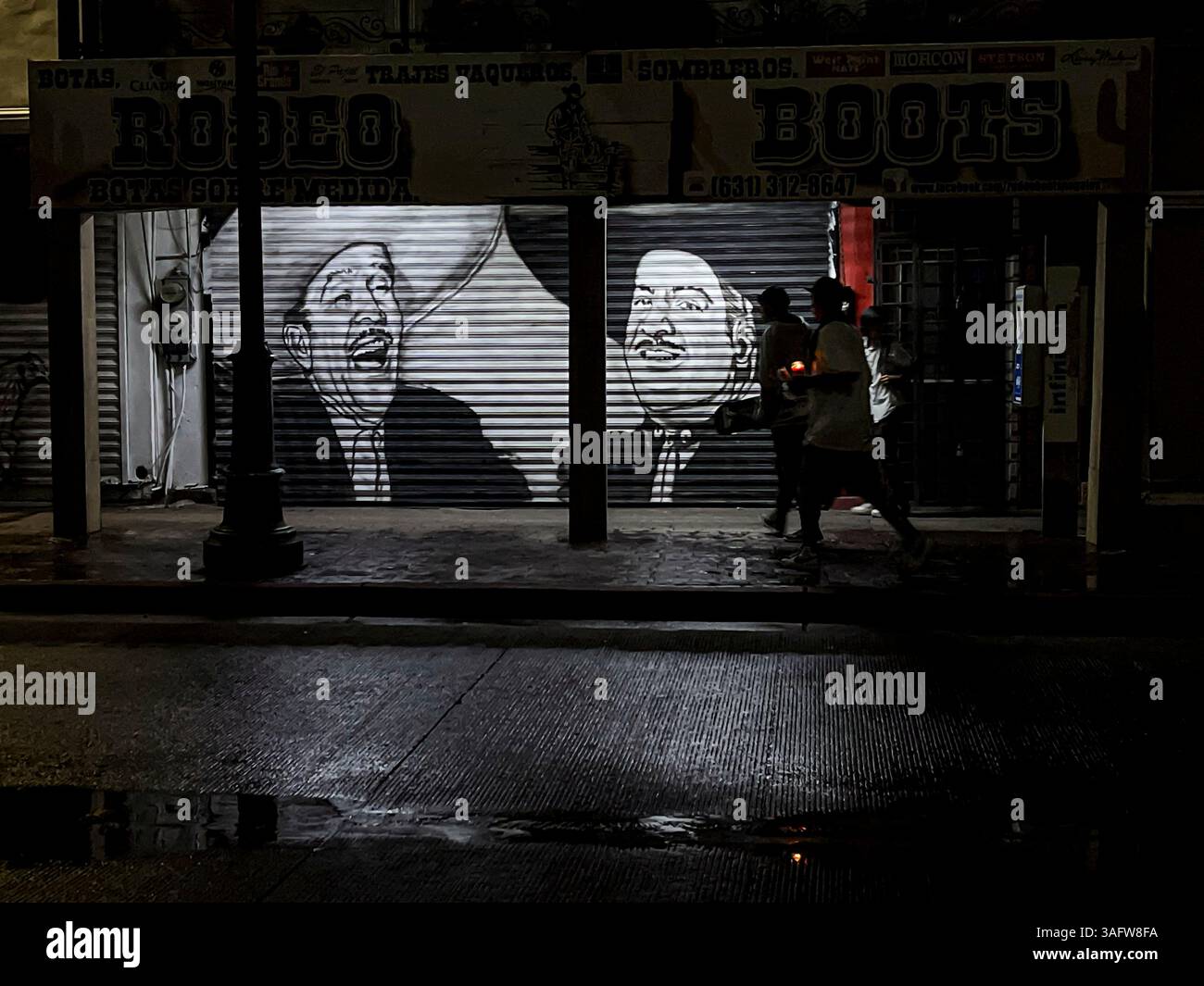 Jimenez are seen at the murals of historical figures on the steel ...