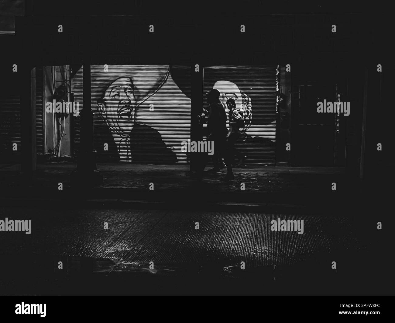 Jimenez are seen at the murals of historical figures on the steel ...