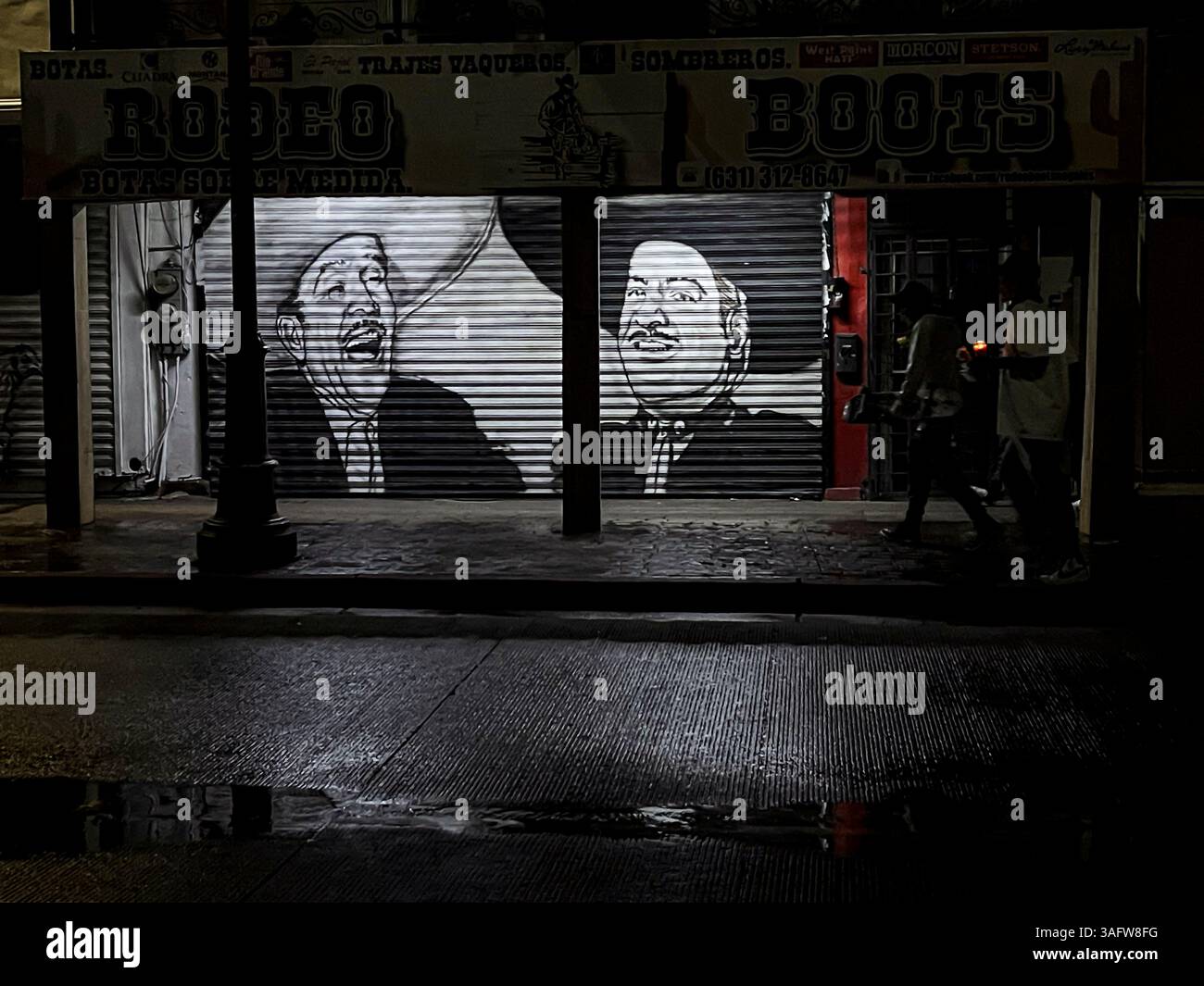 Jimenez are seen at the murals of historical figures on the steel ...