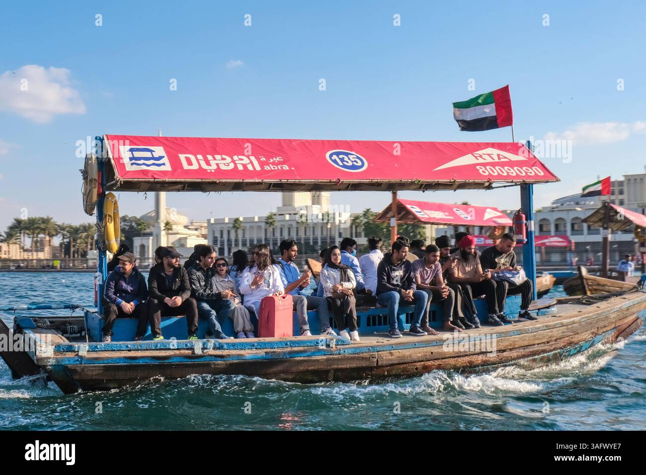 Group of local people and tourists are ferries to Creek side by water ...