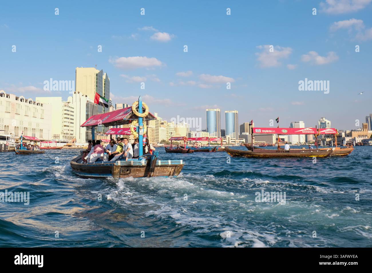 Group of local people and tourists are ferries to Creek side by water ...