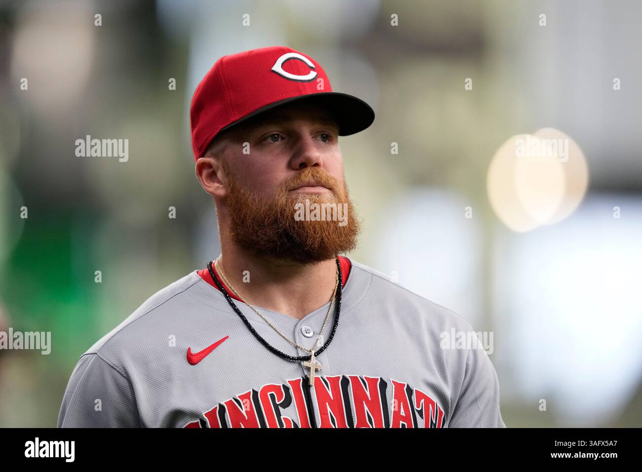 Cincinnati Reds' Blake Dunn warms up before a baseball game against the ...