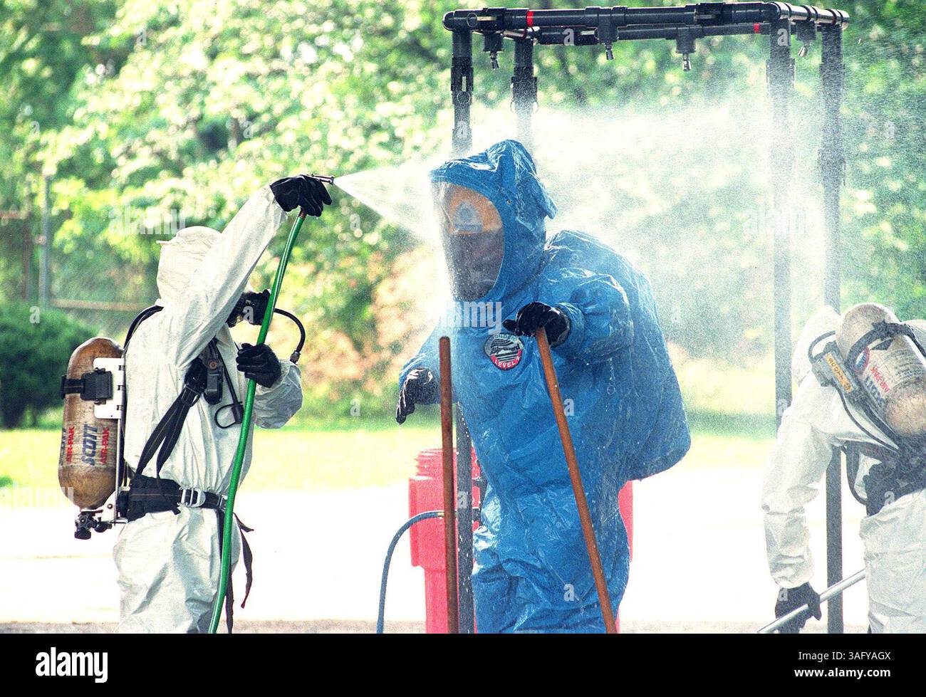 Alexandria, VA, Haz-Mat personnel decontaminate personnel who cleaned ...