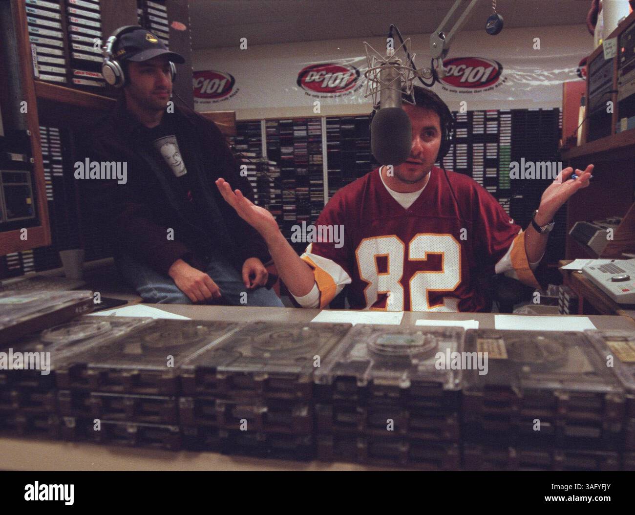 DC101 Morning DJ Elliot Segal chats with a caller while assistant Jared ...