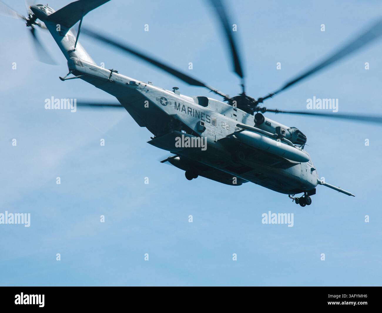 A U.S. Marine Corps CH-53E Super Stallion with Marine Medium Tiltrotor ...