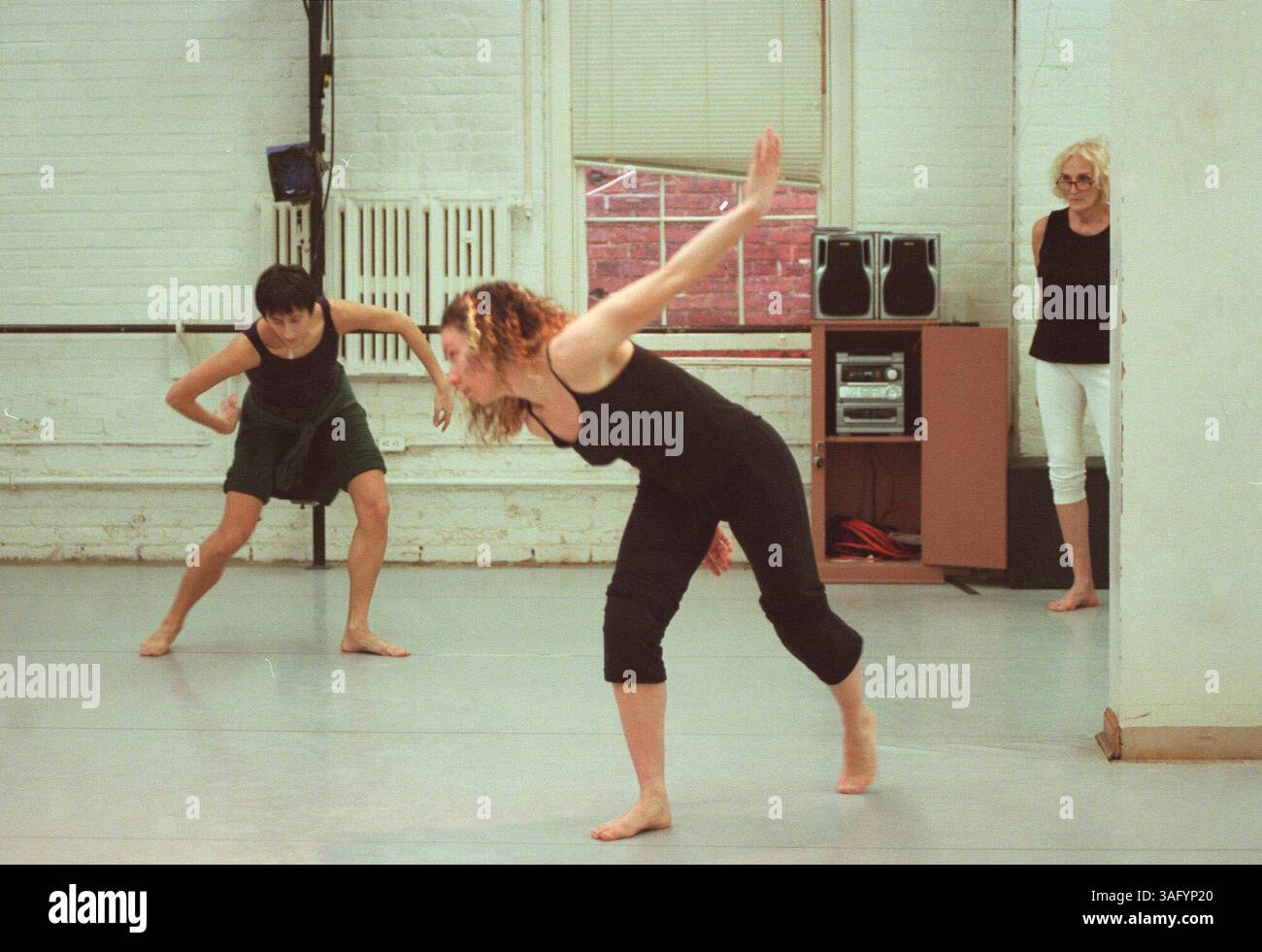 GWU dance professor Maitha Withers, left, watches as dancers Adrienne ...
