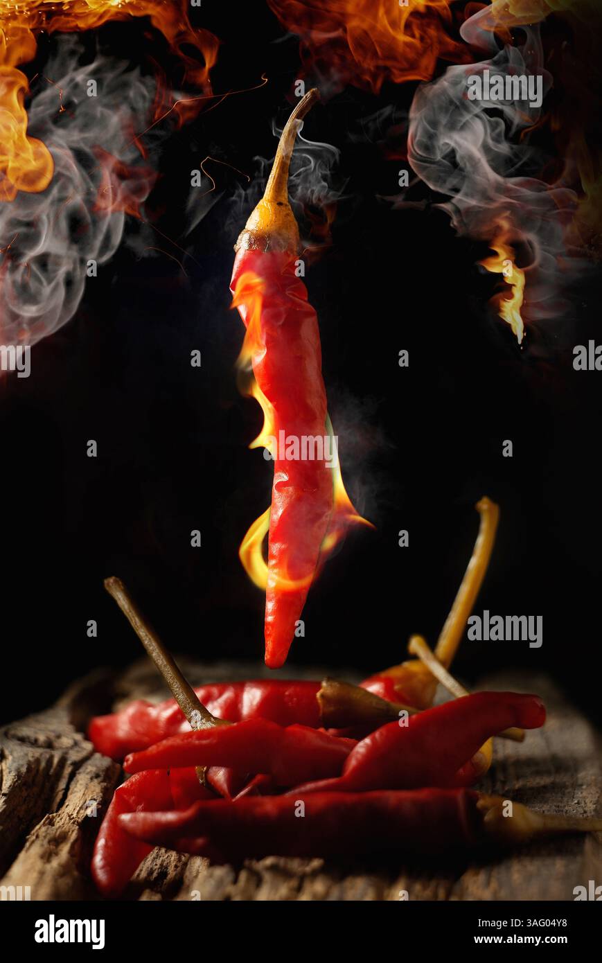 Red hot chili peppers burns. A blackout background on fire Stock Photo ...