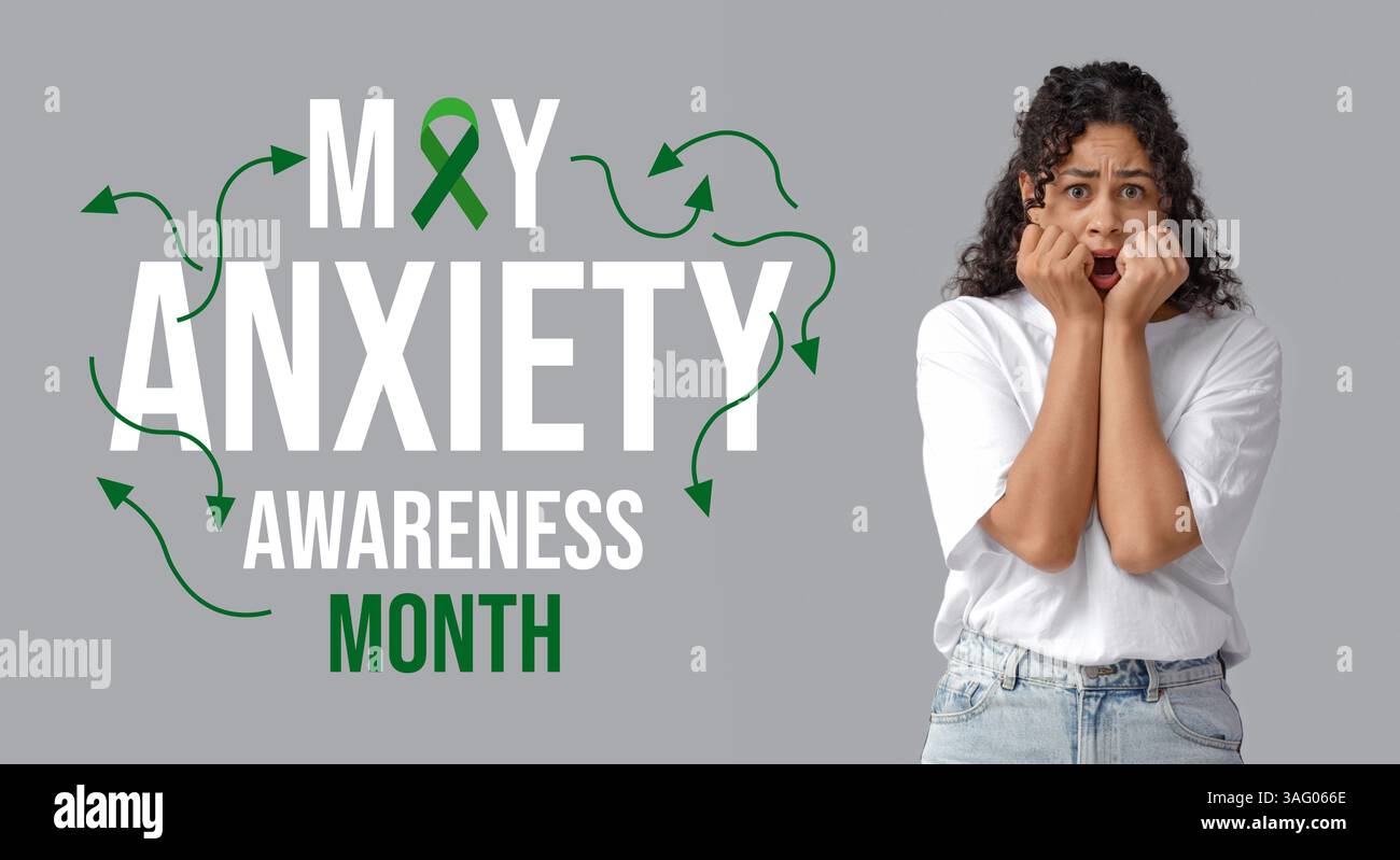 Young African-American woman having panic attack on grey background ...