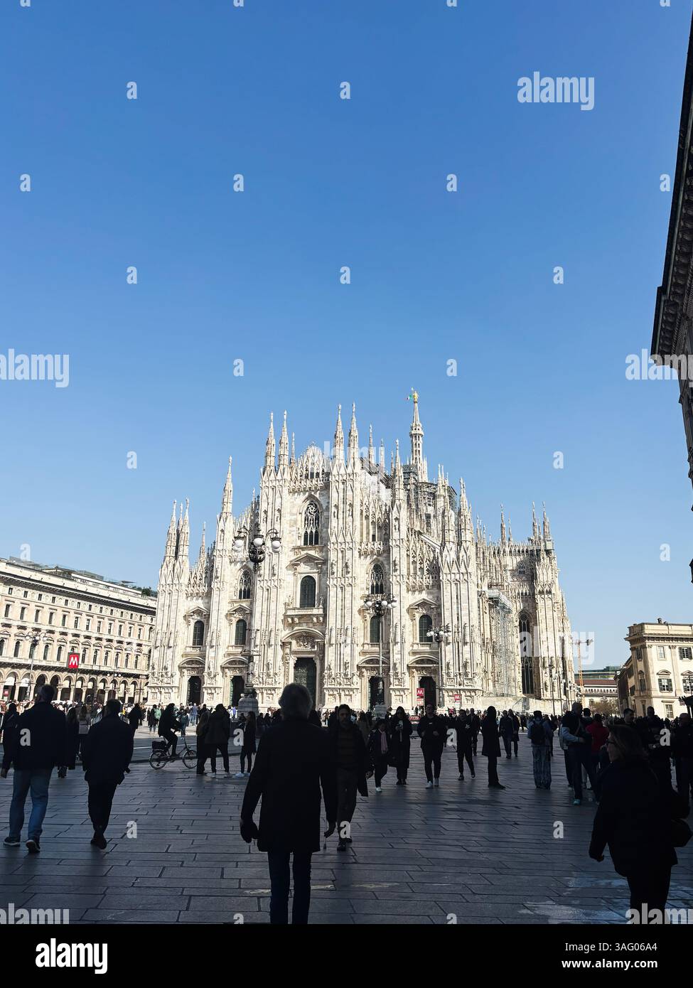 Milan, Italy - March 26, 2025: Magnificent Duomo in Milan with visitors ...