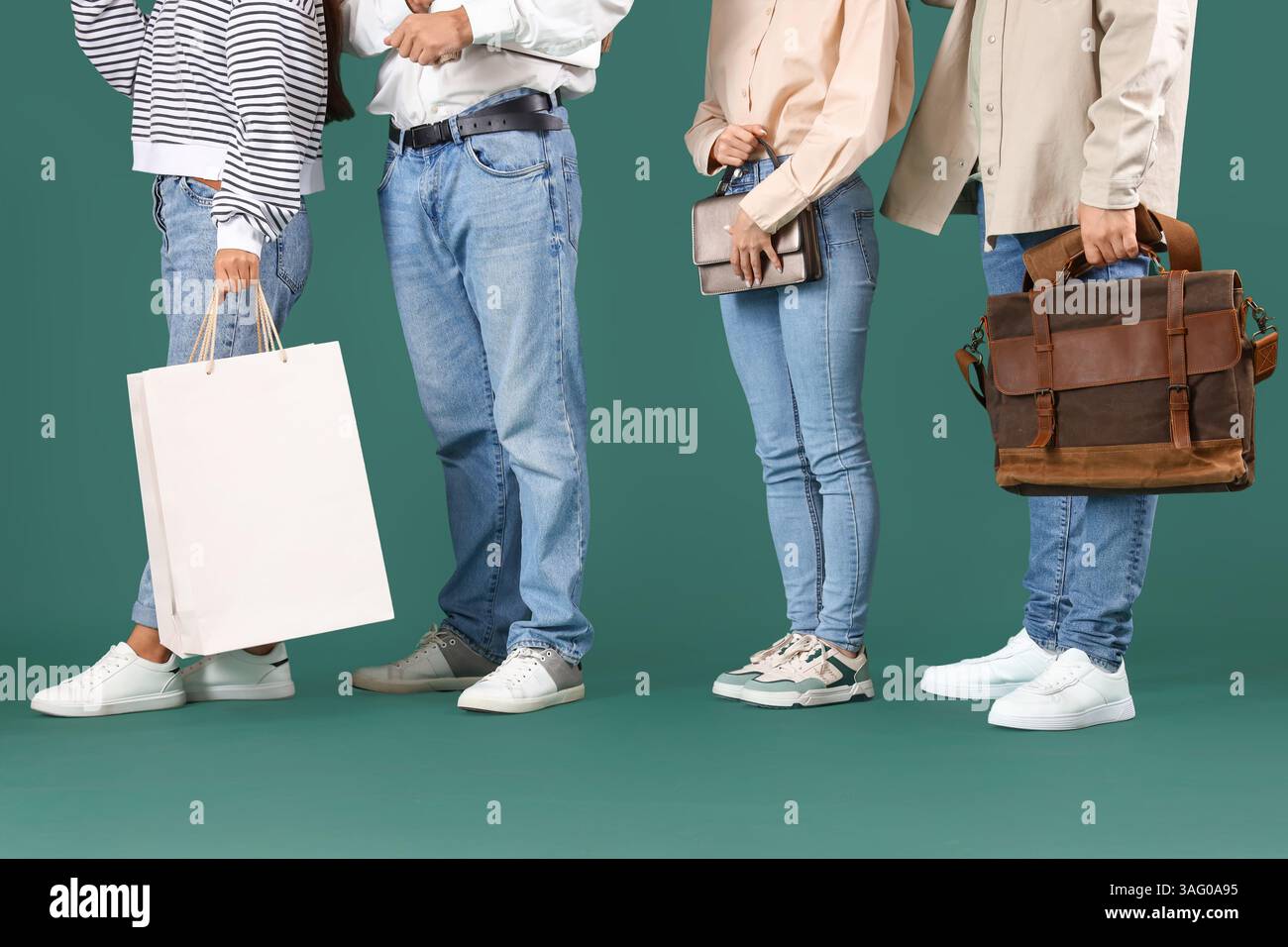 People waiting in line on green background Stock Photo - Alamy