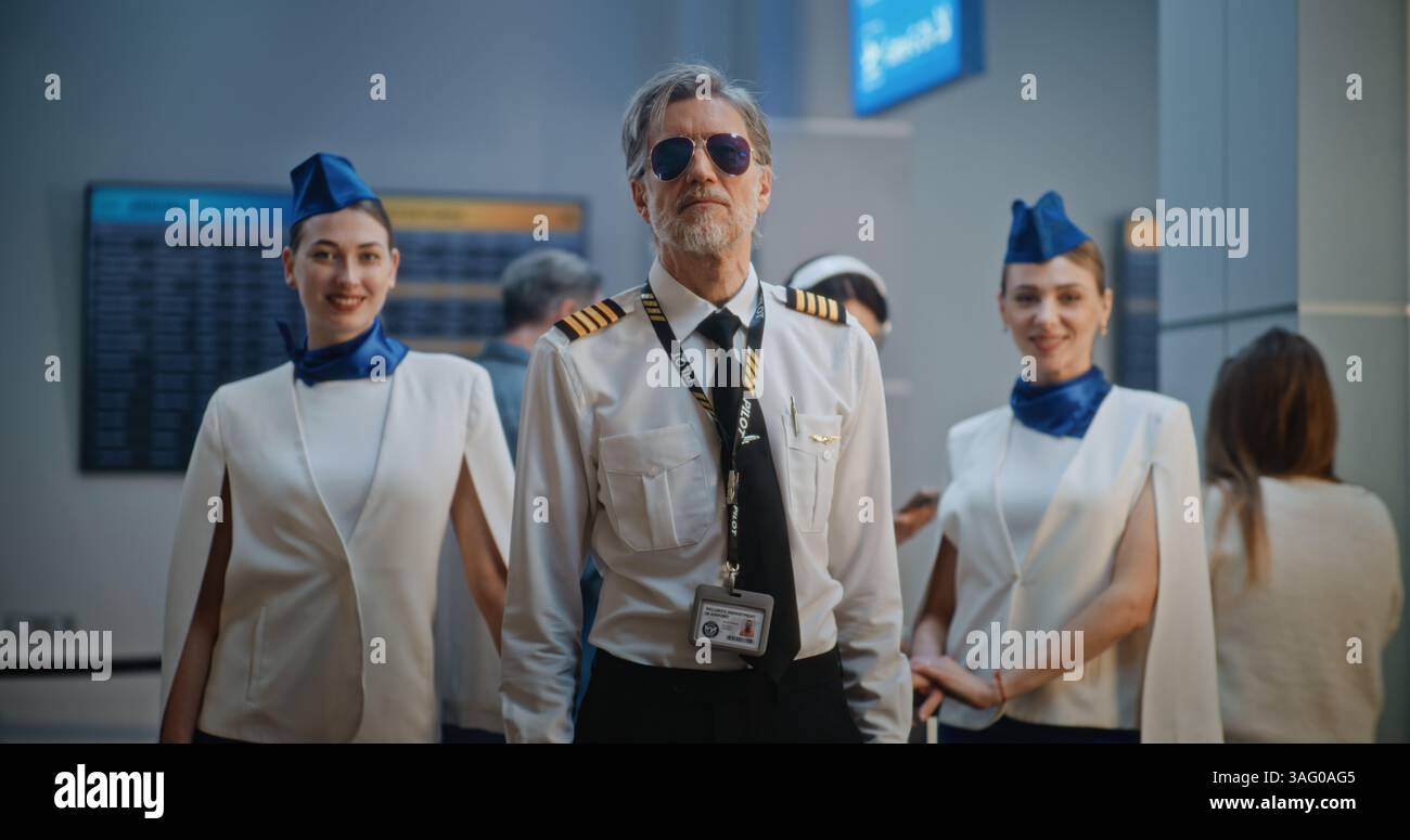Portrait of Professional Airline Pilot and Two Beautiful Flight ...