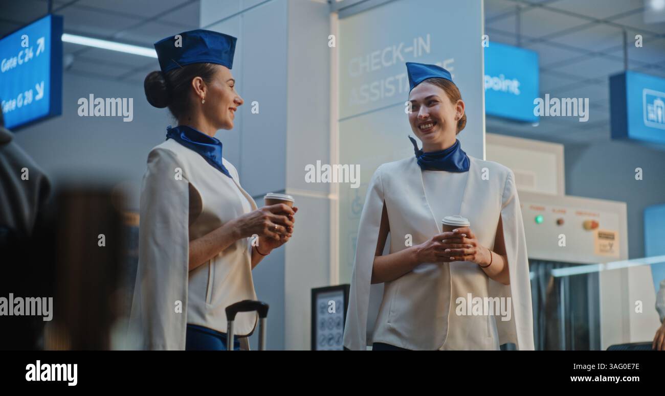 Two Beautiful Stewardesses in Uniforms Standing, Waiting for Boarding ...