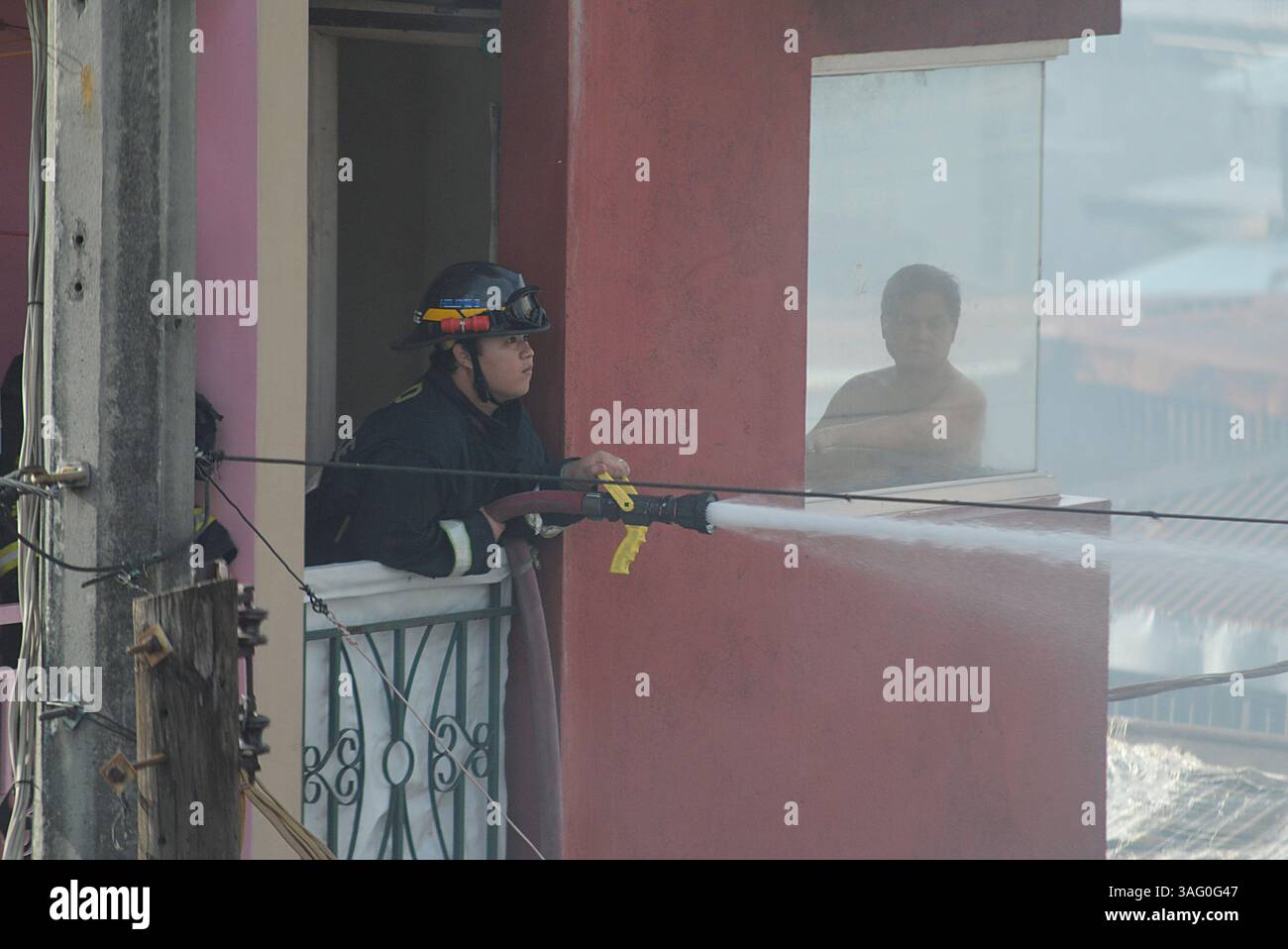 Aug. 22, 2012 - Manila, Philippines - A fireman continues to extinguish ...