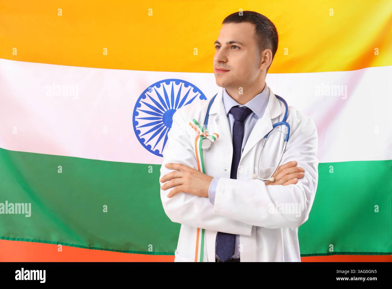 Male physician with ribbon against flag of India. National Doctor's Day ...