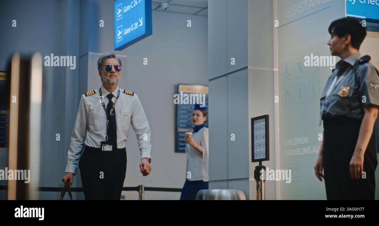 Flight Crew in Airport Terminal: Airline Captain and Two Beautiful ...