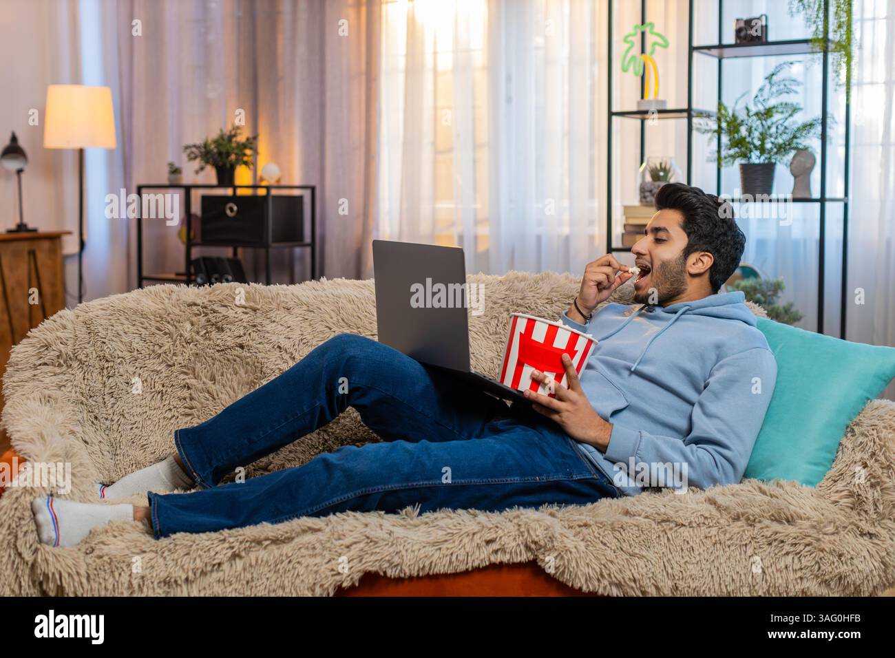 Happy indian man entertained hi-res stock photography and images - Alamy