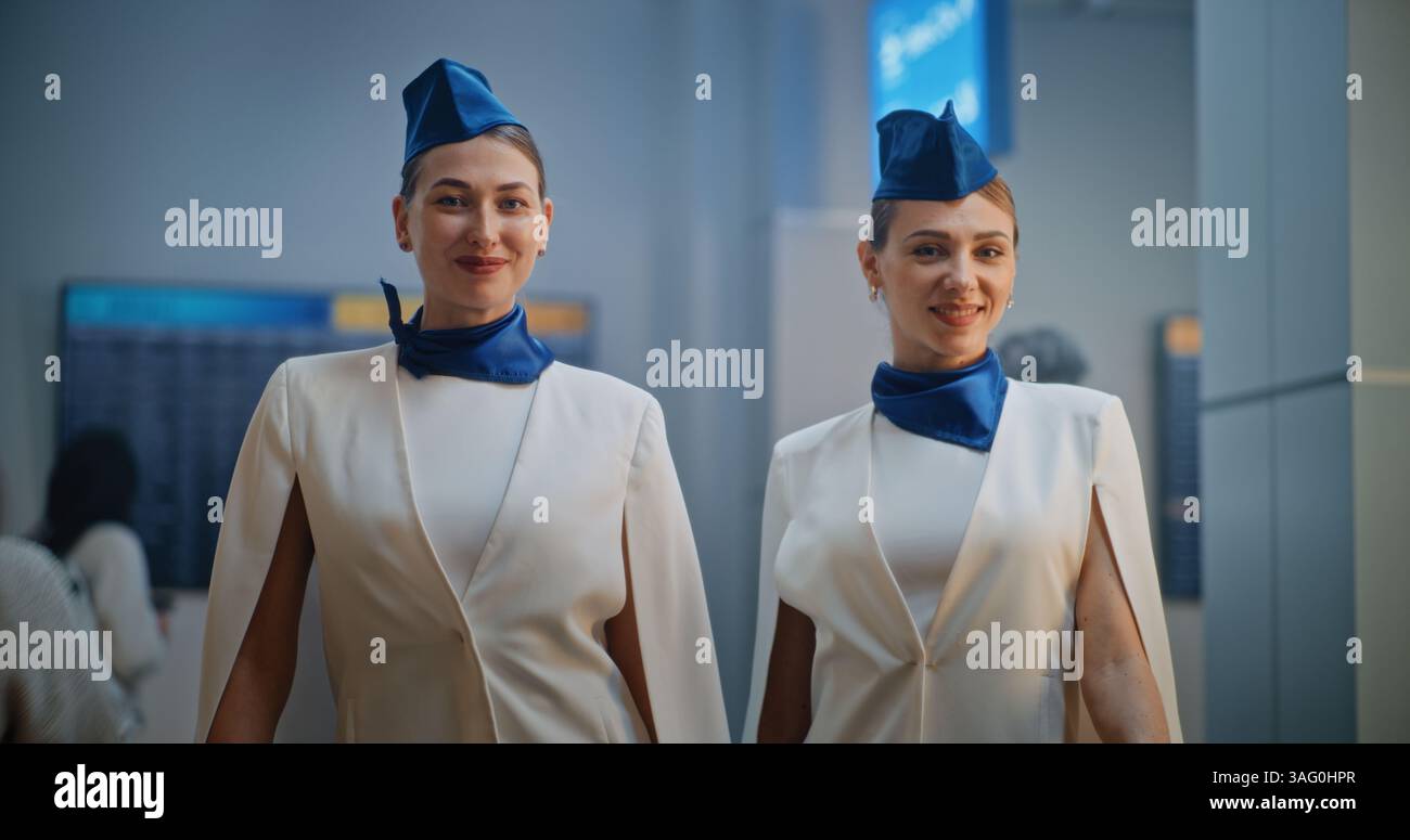 Two beautiful stewardesses in elegant hi-res stock photography and ...