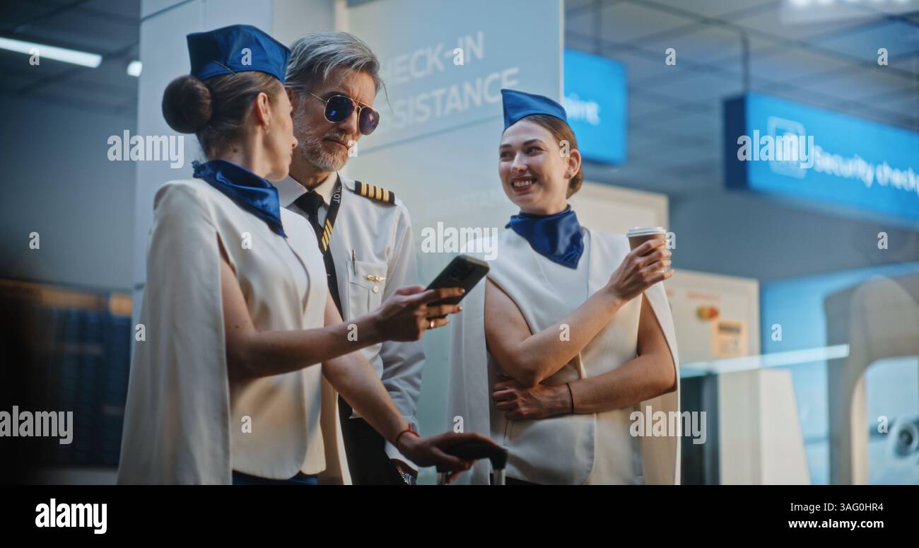 Two Beautiful Stewardesses in Uniform Using Phone, Waiting for Boarding ...
