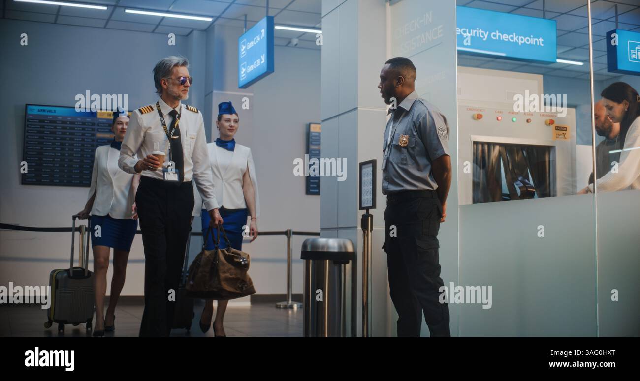 Flight Crew in Airport Terminal: Mature Airline Pilot and Two Beautiful ...