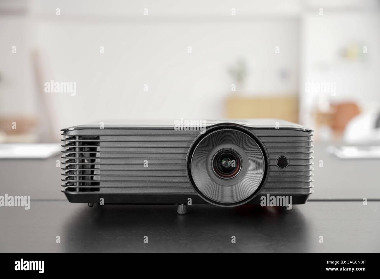 Modern projector on desk in conference hall, closeup Stock Photo - Alamy