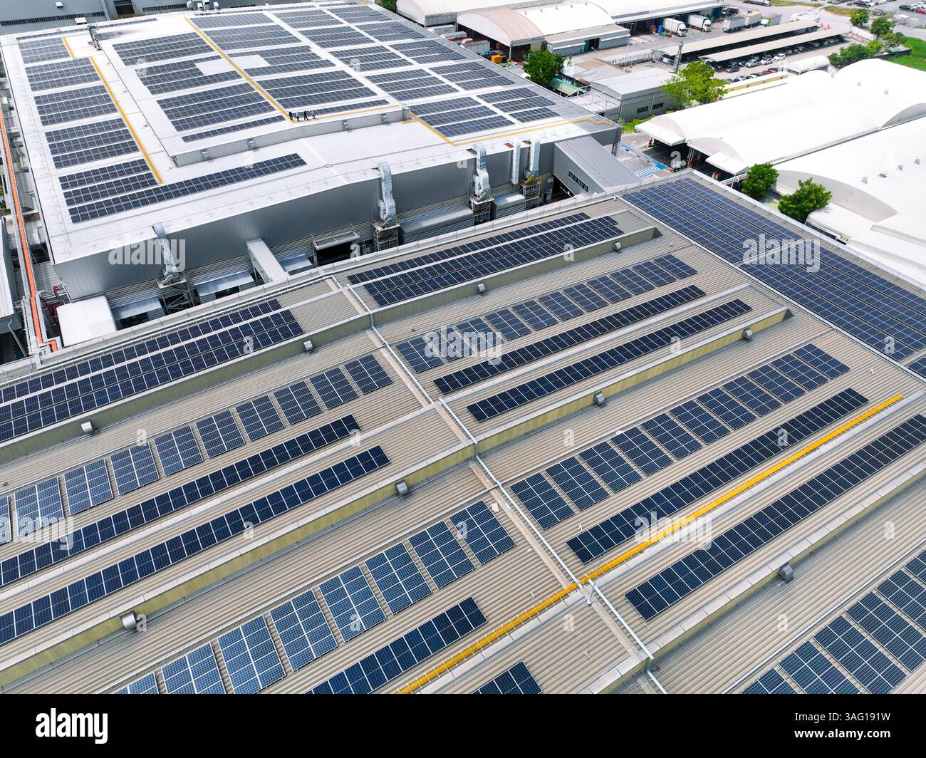 Solar-powered warehouse facility. Modern distribution center with ...
