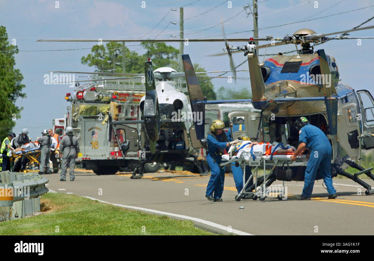 photo 1 of 2.CAPTION: (08/29/2007, WESLEY CHAPEL) Helicopters crowd a ...