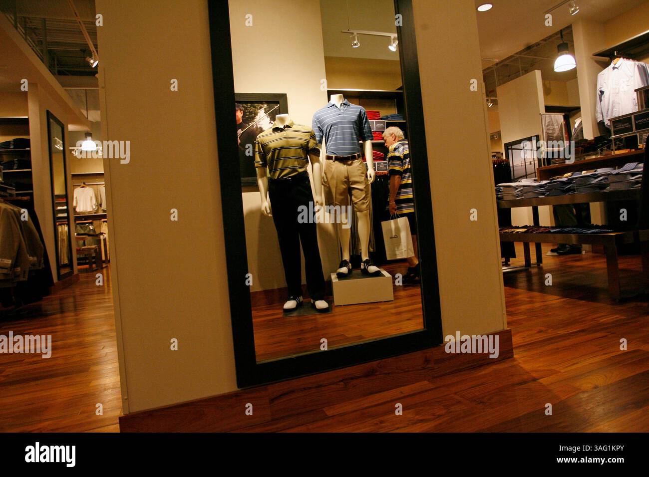 PHOTO # 3 ] ..08 20 2007 - TAMPA - A selection of casual to formal men's clothes for sale inside ...