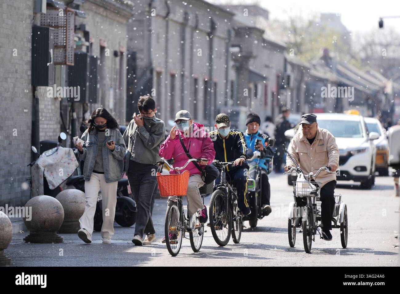 Beijing,China.6th April 2025. People walk on the street, covering their ...