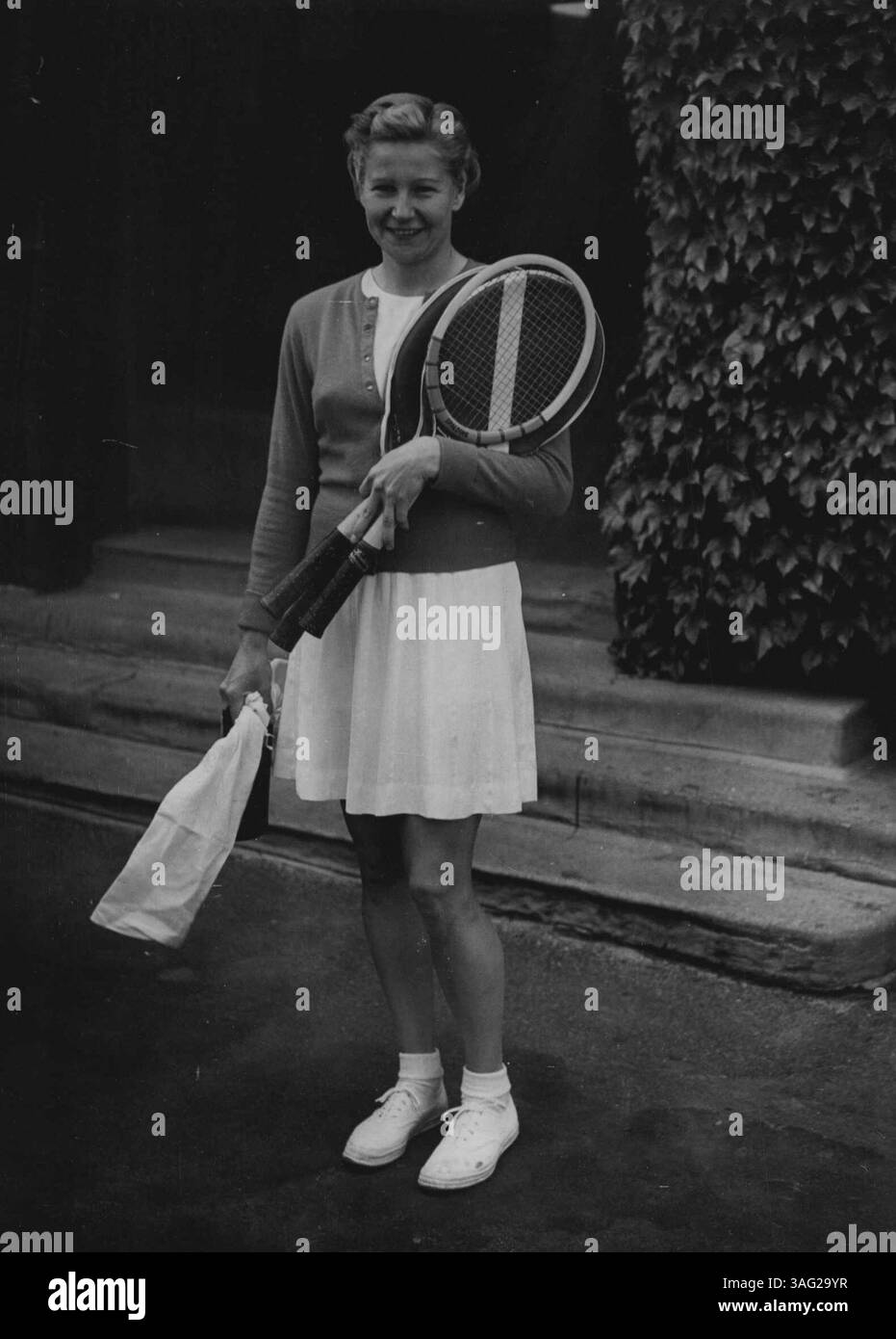 Her arm better, after a severe attack of tennis elbow, Miss Louise ...