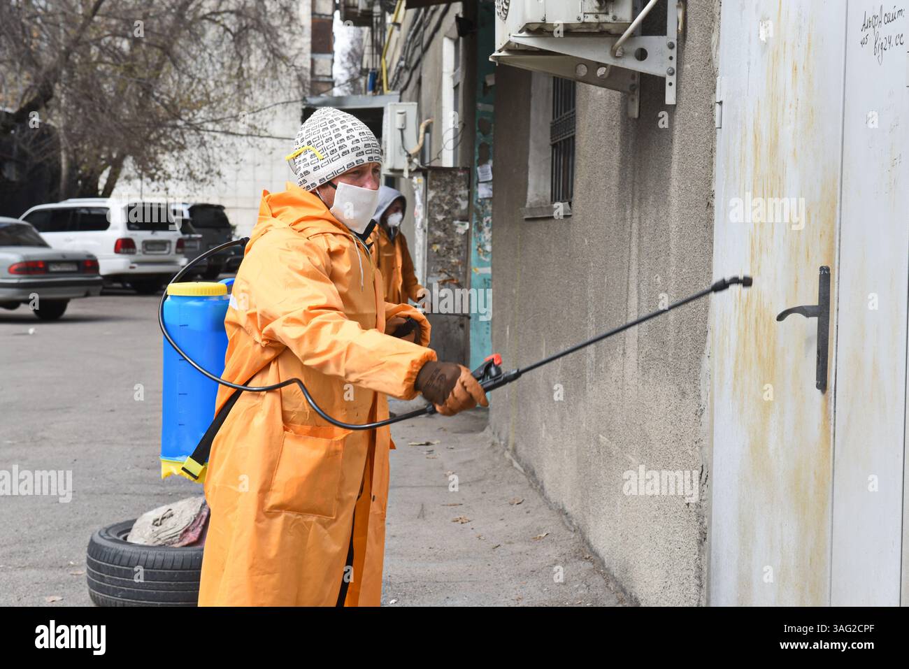 The disinfection service cleans courtyards and entrances Stock Photo ...