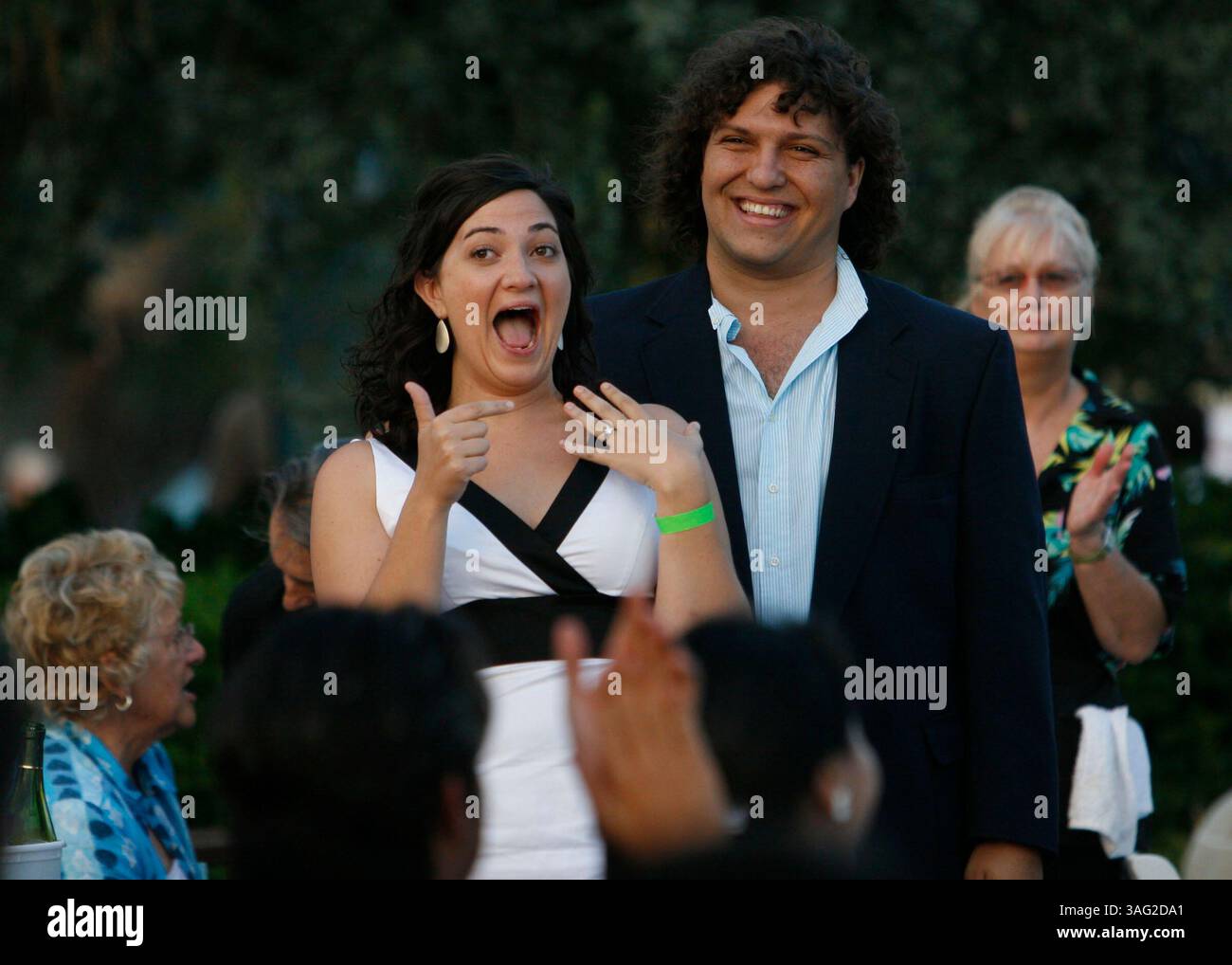 Shows off her new diamond engagement ring hi-res stock photography and ...