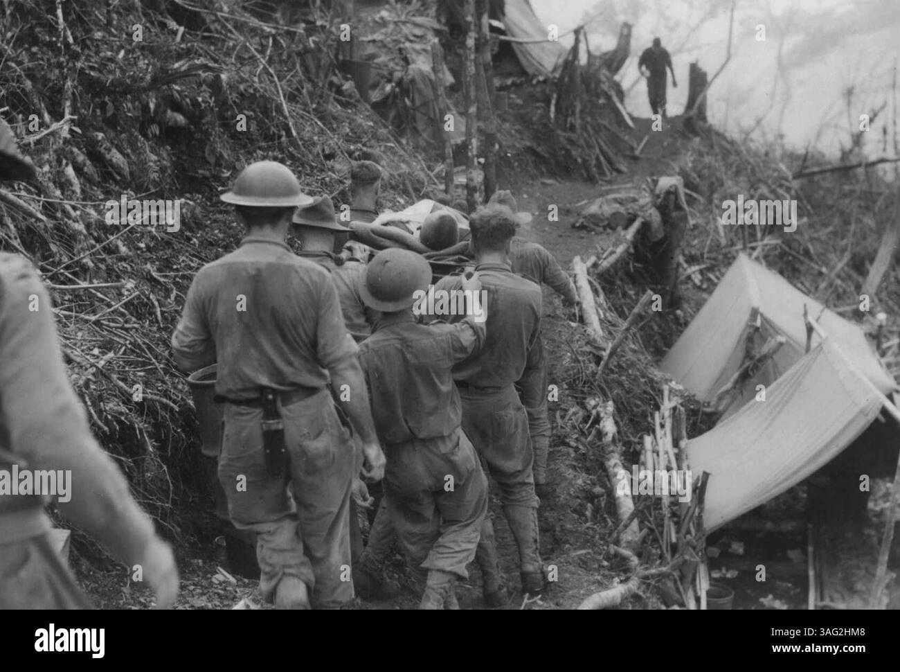 Stretcher bearers convey the wounded to the regimental aid post from a ...