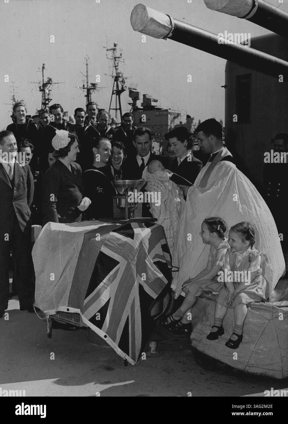 The ship's bell, upside down on the White Ensign, is the font, as ...