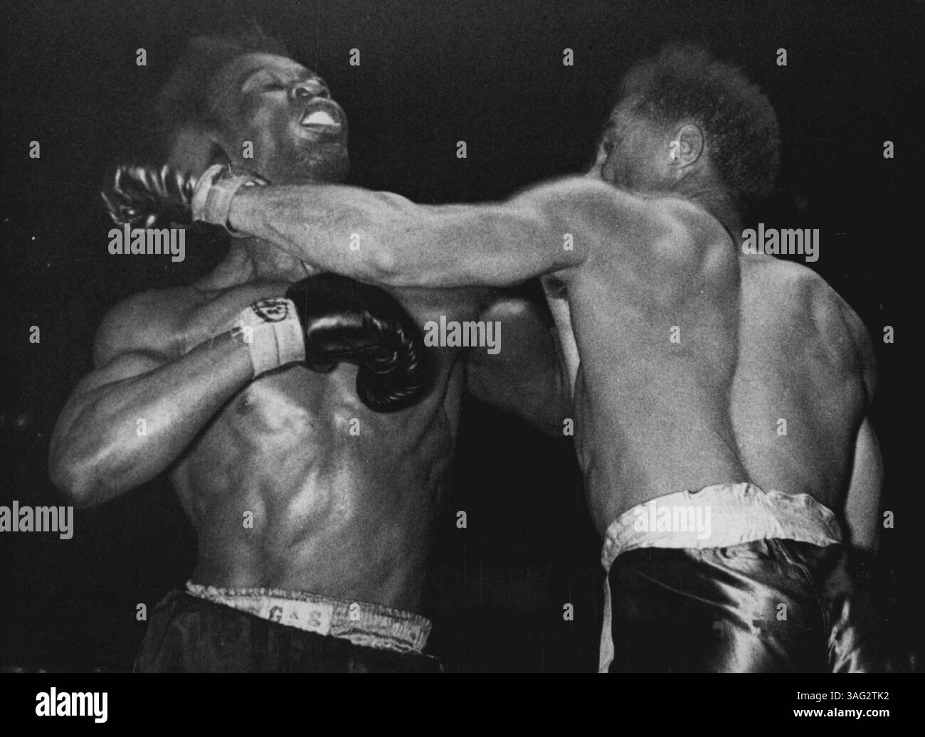 Alex Buxton (right) of Watford, delivering a left to the head of Bobby Dawson (U.S.A), during ...