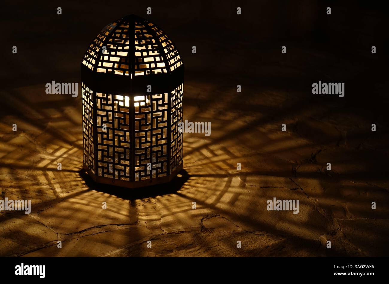 Traditional Lantern Casting Geometric Shadows on Stone Floor at Night ...