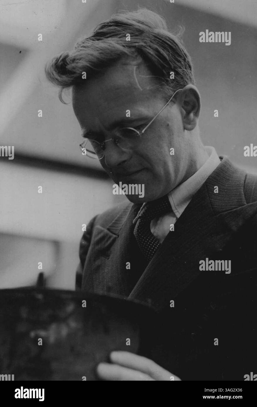 Today's picture of Professor Burstall, examining part of a producer gas ...