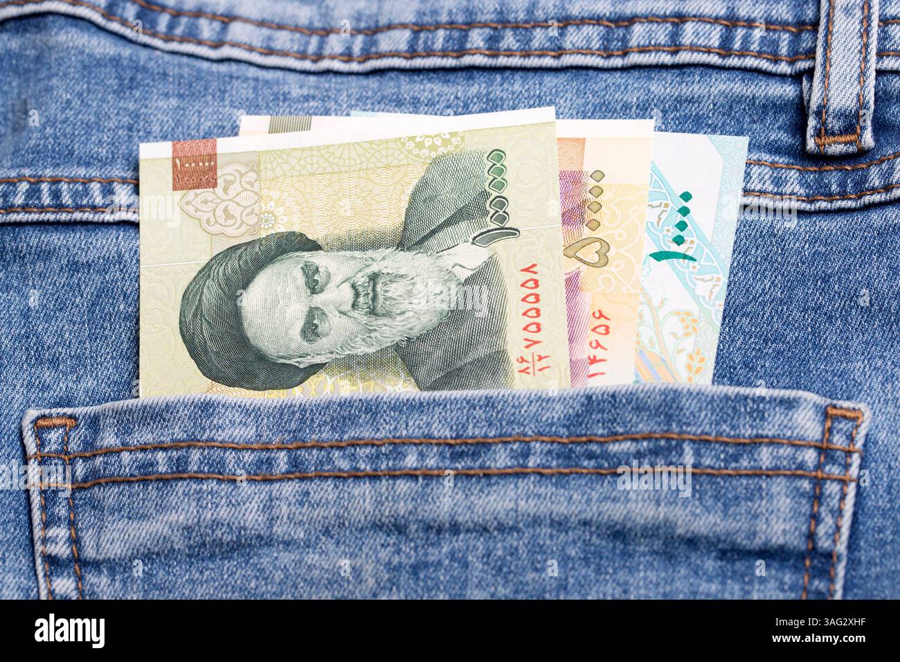 Old Iranian money - Rial in the pocket of blue jeans Stock Photo - Alamy