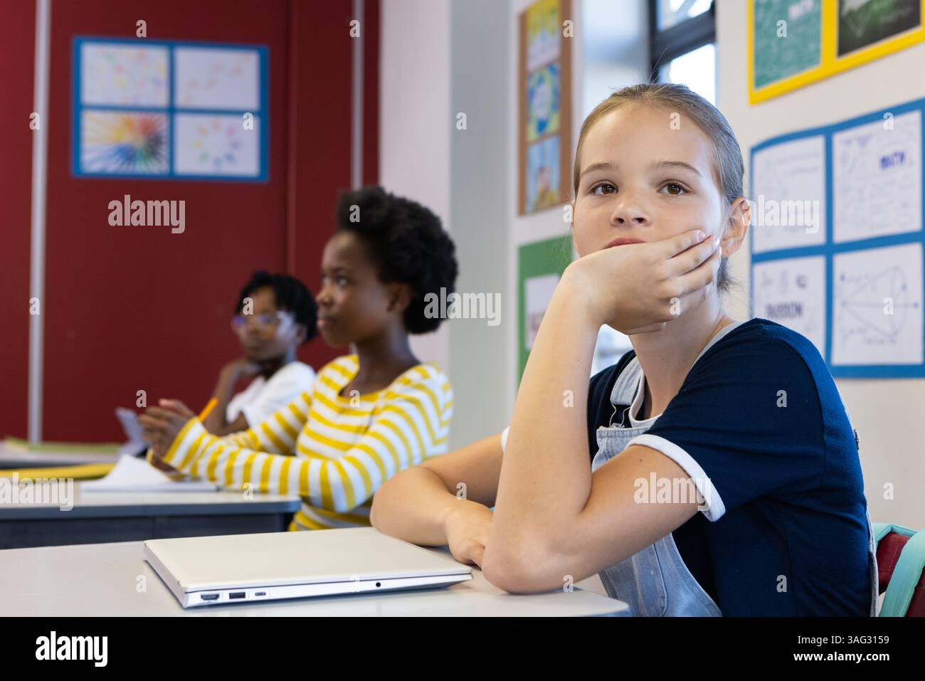 Attentive schoolgirl reading book hi-res stock photography and images ...