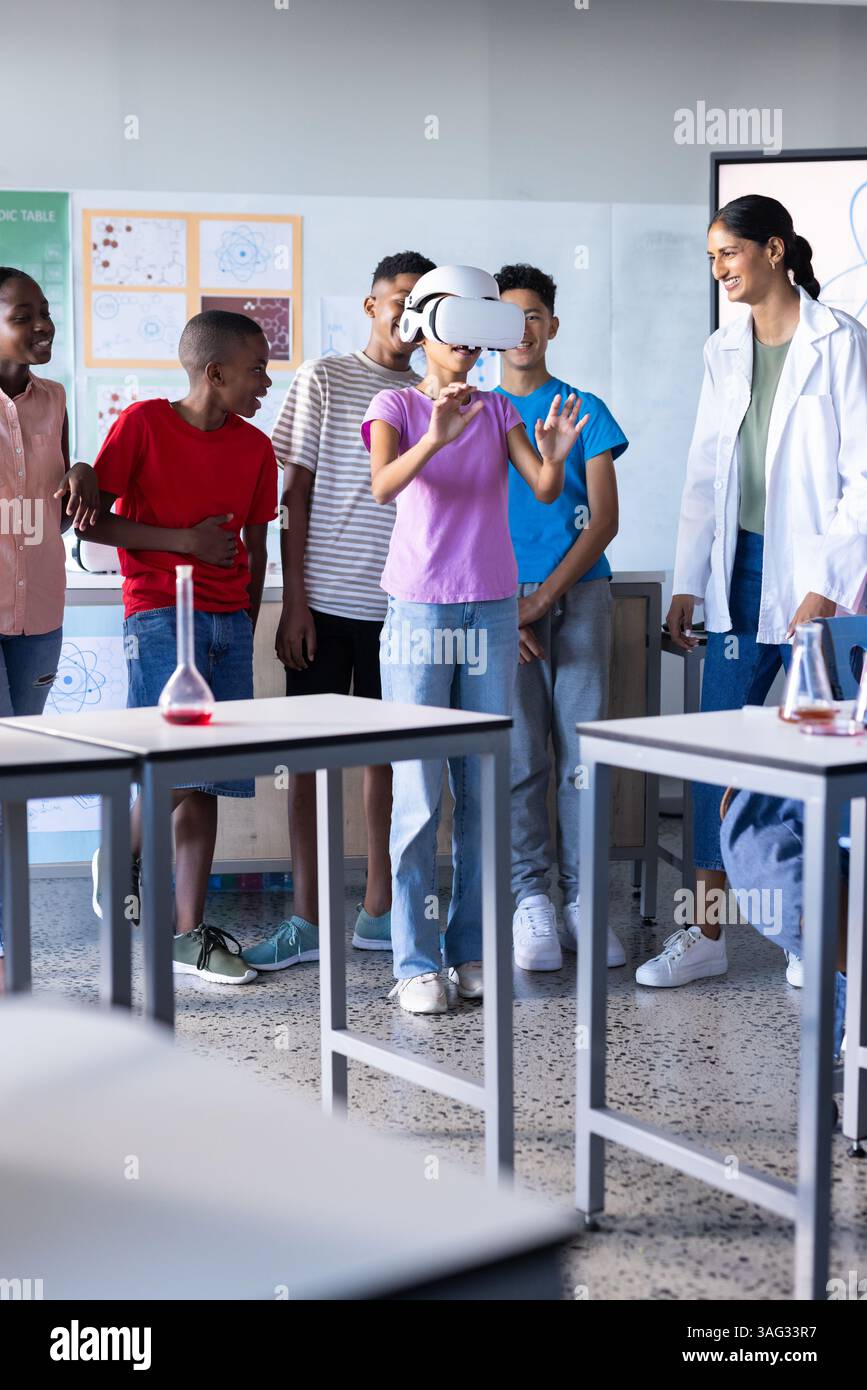 Using VR headset, student engaging in virtual experiment in school ...