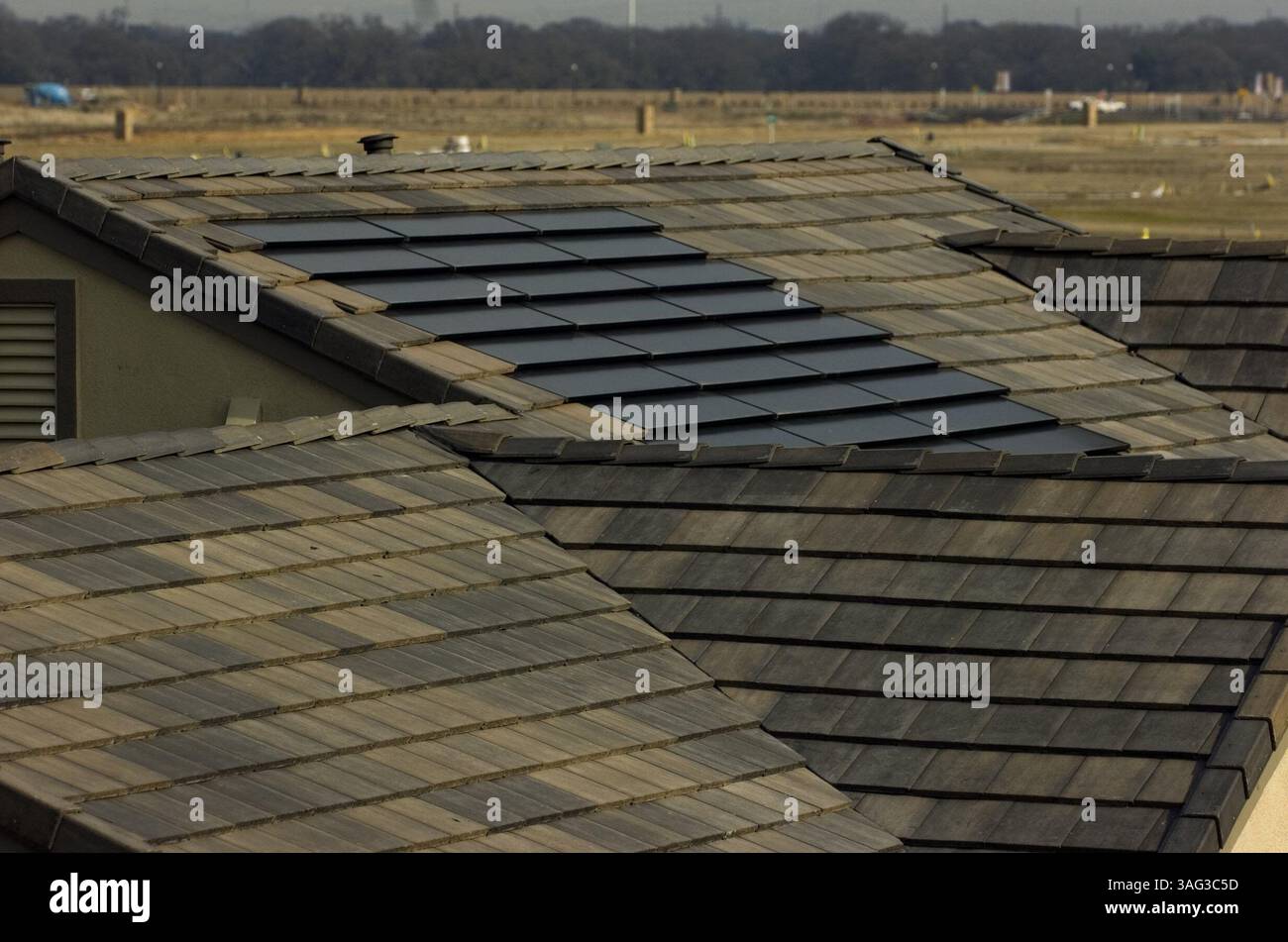 Solar panels on the model homes sit flush with the roof of the homes at ...