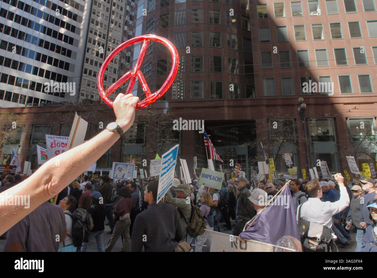 A protesters displays a peace sign during the march up Market Street to ...