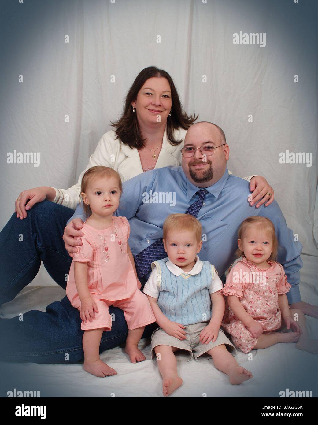 Front row, from left to right: 2-year-old triplets Madison McCarley, Nicholas McCarley, and ...
