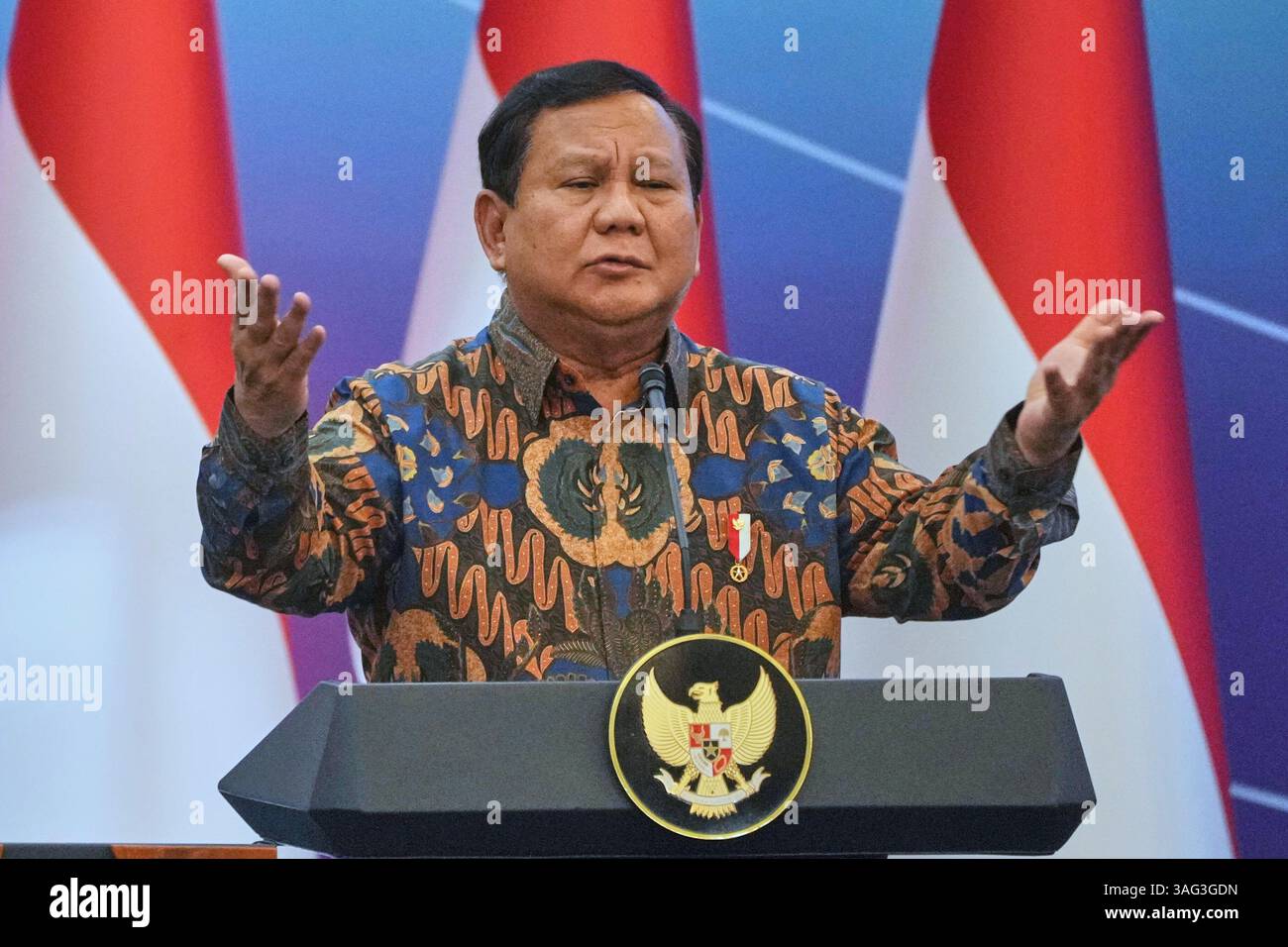 Indonesian President Prabowo Subianto gestures as he delivers a speech ...