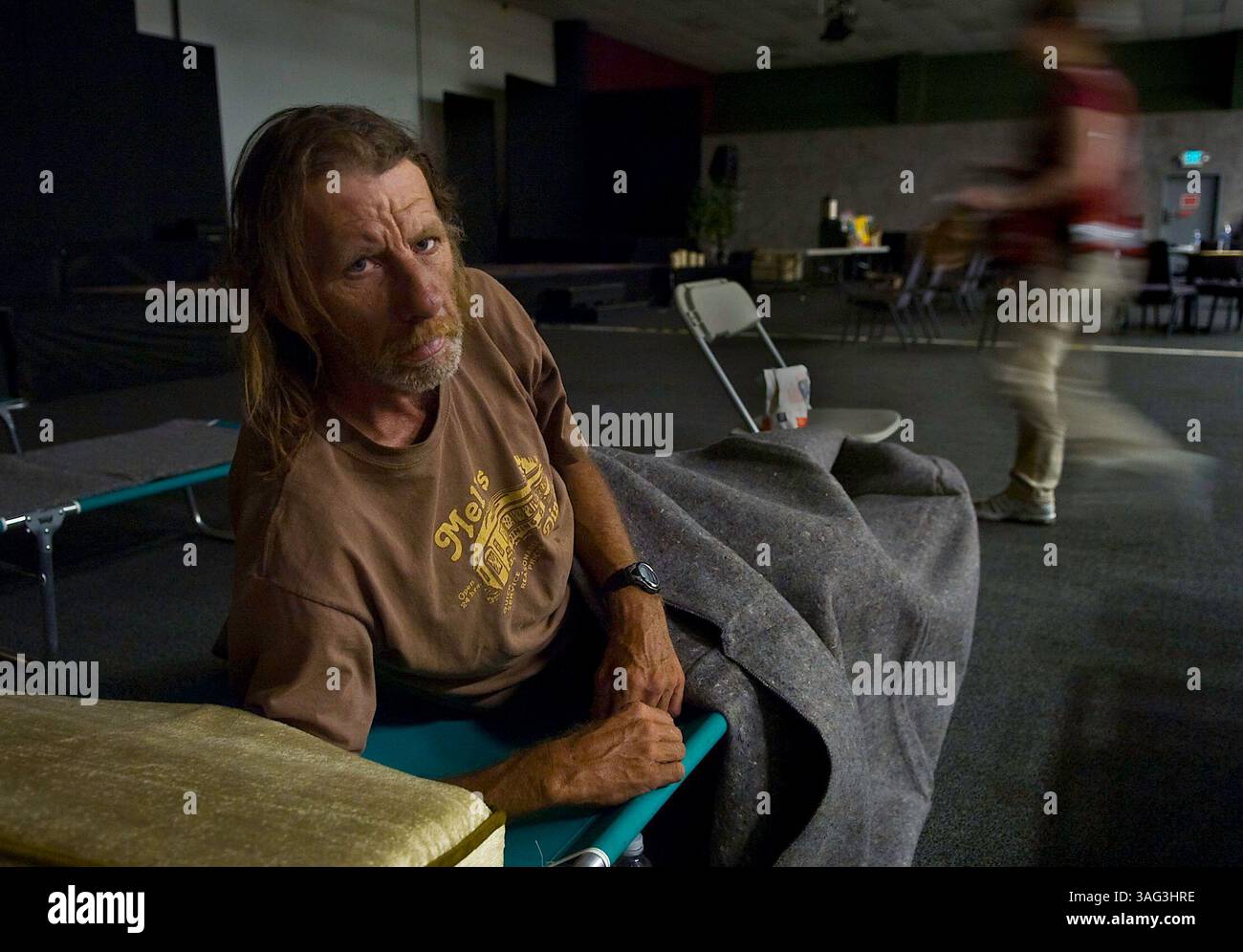 Eugene Wayne Graham (cq) rests on a cot at a Red Cross evacuation ...